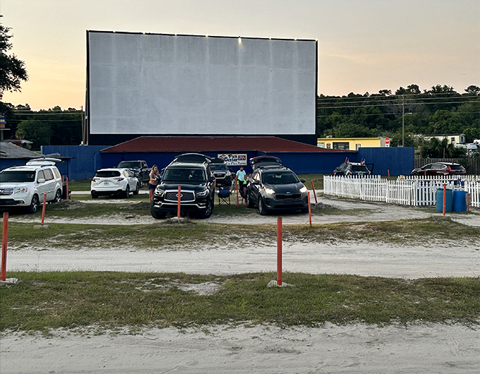 Showtime at the Ocala! Cars line up facing the illuminated screen, each creating their own perfect little movie-watching bubble.