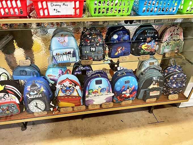 Disney backpacks line the shelves like colorful time capsules, each design capturing a moment when character art and fashion collided.