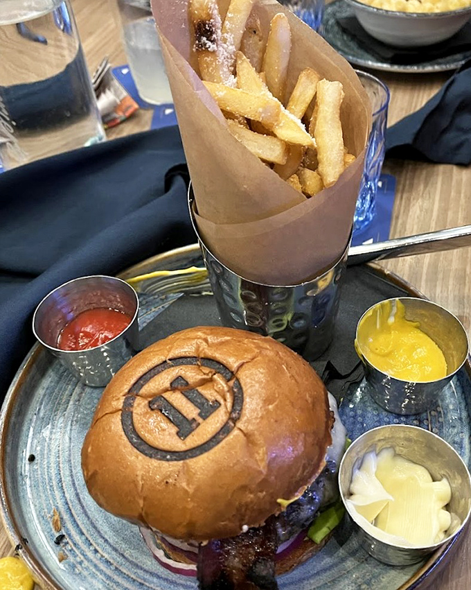This isn't just a burger &ndash; it's a branded experience, complete with custom-stamped bun and fries standing at attention.