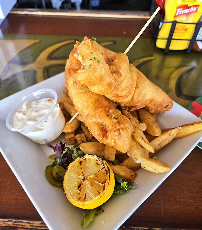 Battered Fish and Chips Special: Golden-battered fish that shatters with each bite, served with fries that somehow maintain their crispness despite Florida's humidity.