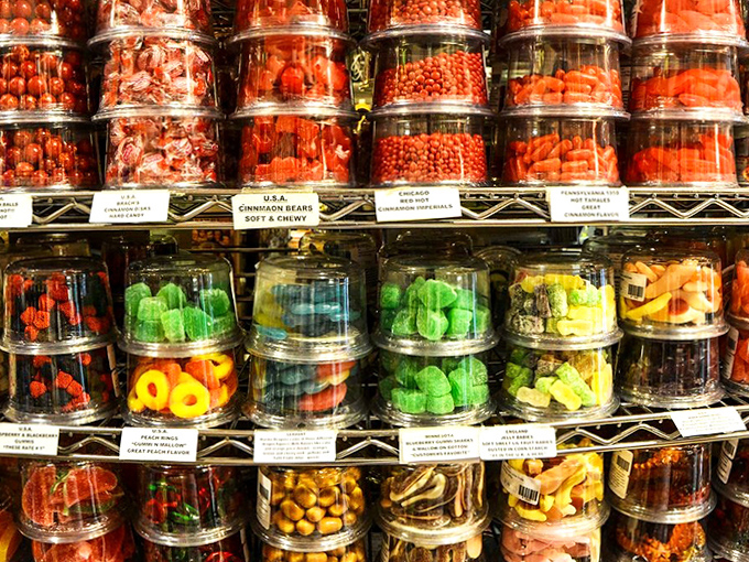 Clear candy containers create a colorful laboratory of sweetness, where childhood memories are stored in plastic tubs, waiting to be rediscovered.