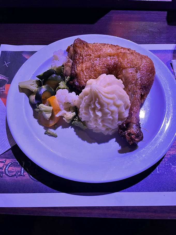 A perfectly roasted turkey leg with mashed potatoes and vegetables &ndash; medieval feast meets Caribbean adventure on a single plate.