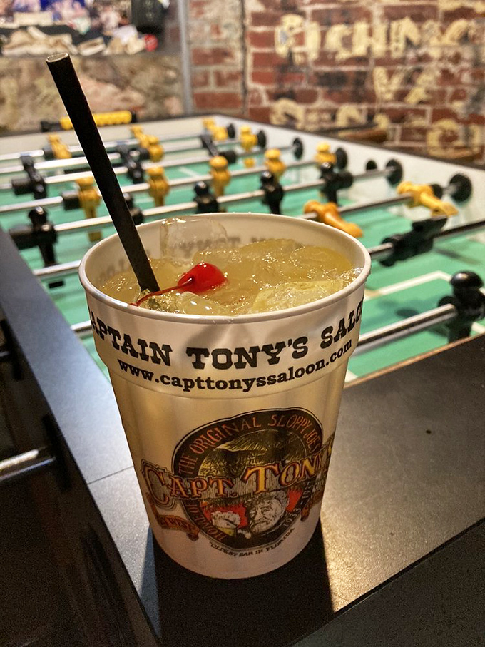 A classic cocktail rests on the foosball table &ndash; multitasking at its finest for those who like their competition with a side of refreshment.