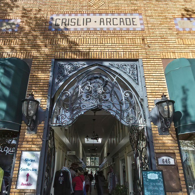 The historic Crislip Arcade stands as an elegant gateway to artistic adventures, its ironwork entrance whispering tales of old St. Petersburg.