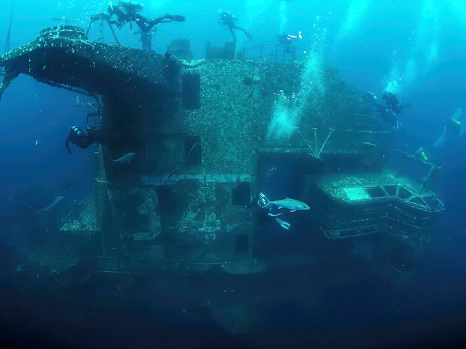 Talk about office views! Military personnel chose the Oriskany's underwater deck for their reenlistment ceremony &ndash; patriotism with a splash.