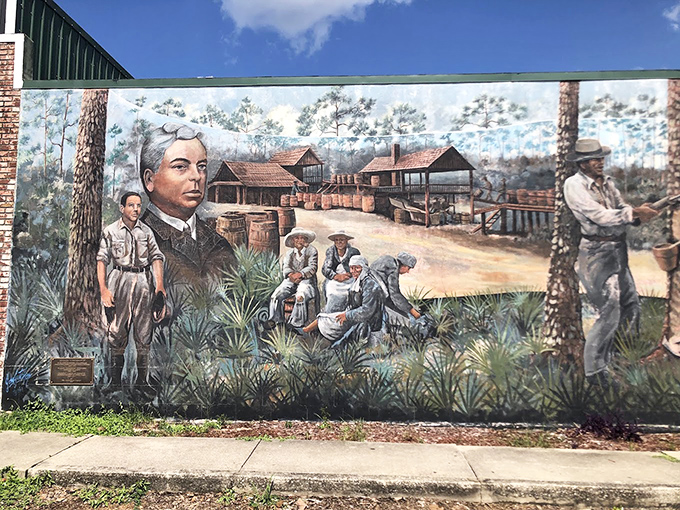 Early Settlement And Turpentine Industry Mural Faces from the past stare across time, telling silent stories of sweat, pine sap, and frontier determination.