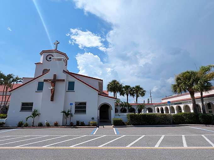 Welcoming all who enter, the church's entrance blends traditional design with Florida's tropical charm. Palm trees included!