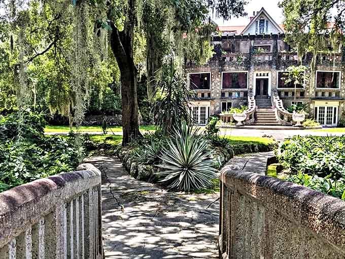 Sunlight plays across the textured exterior, highlighting embedded glass pieces that transform ordinary concrete into a sparkling canvas of architectural whimsy.