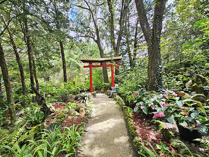 A Torii gate marks the entrance to tranquility, where Japanese garden principles meet Florida's tropical abundance.
