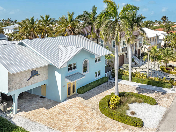 Pastel-colored homes with metal roofs and tropical landscaping define Marathon's residential charm &ndash; paradise with a practical edge.