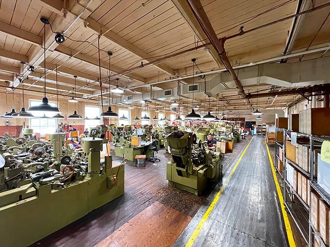 Vintage machinery hums alongside skilled hands in this working time capsule. Each click and whir is the sound of tradition continuing uninterrupted.