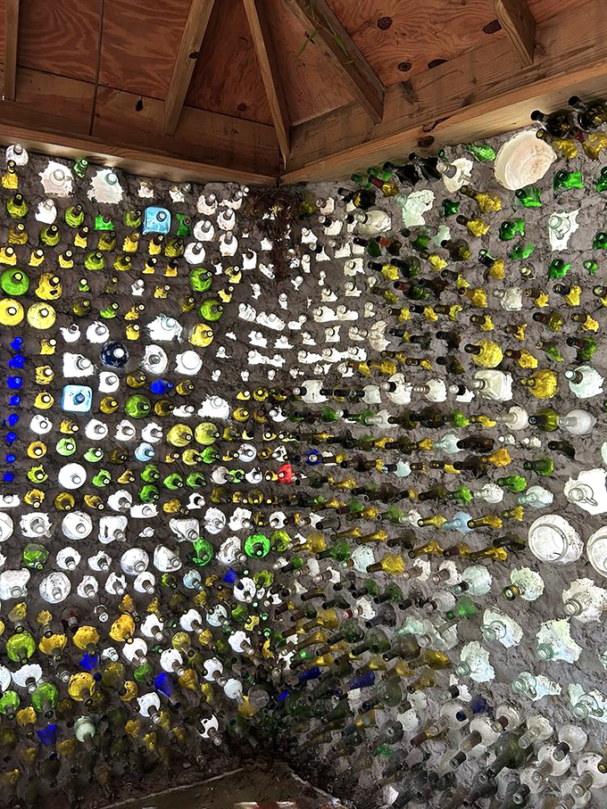 Sunlight streams through the bottle walls, creating a kaleidoscope effect inside that transforms an ordinary room into a magical space.