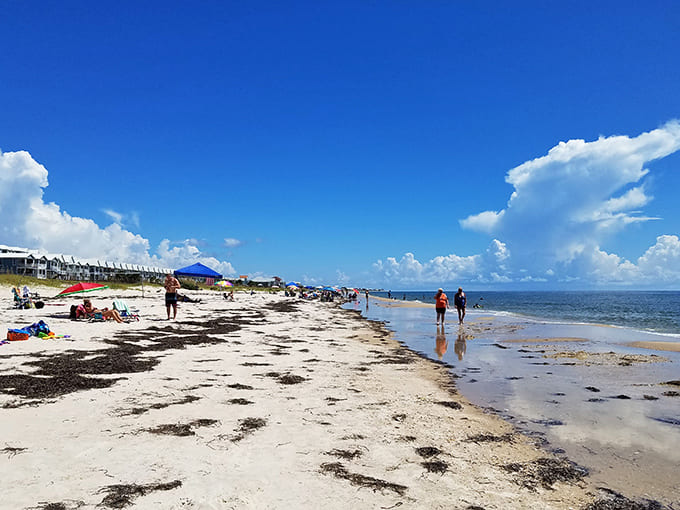 Visitors: Beachgoers enjoying that rare luxury of personal space. No reservation needed for this stretch of coastal heaven.