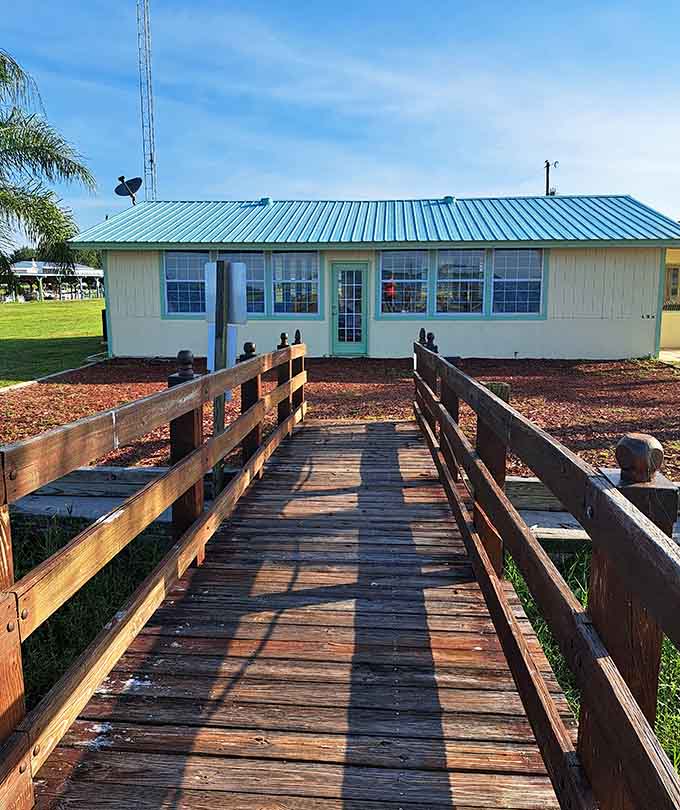This weathered wooden bridge has launched a thousand fishing stories and probably half as many true ones, serving as the gateway between civilization and lakeside serenity.