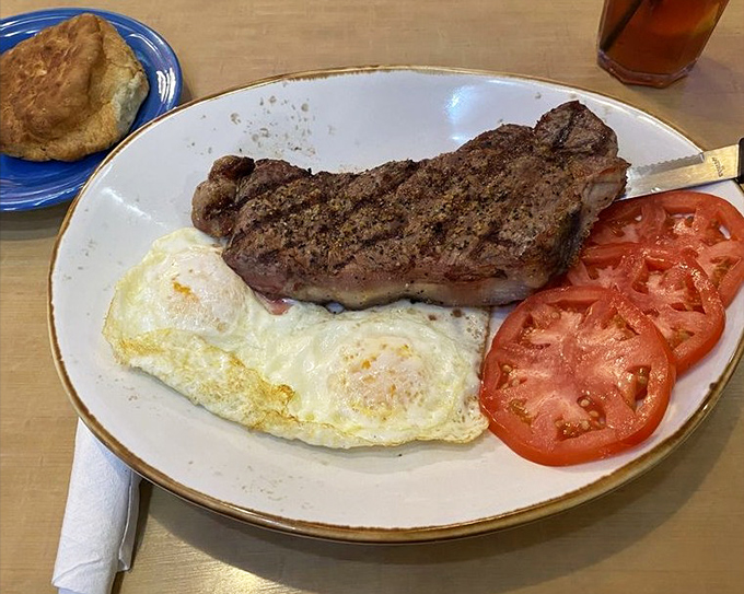 This NY Strip steak arrives with perfectly cooked eggs and sliced tomatoes – a protein-packed breakfast that could fuel a marathon or cure any hangover.
