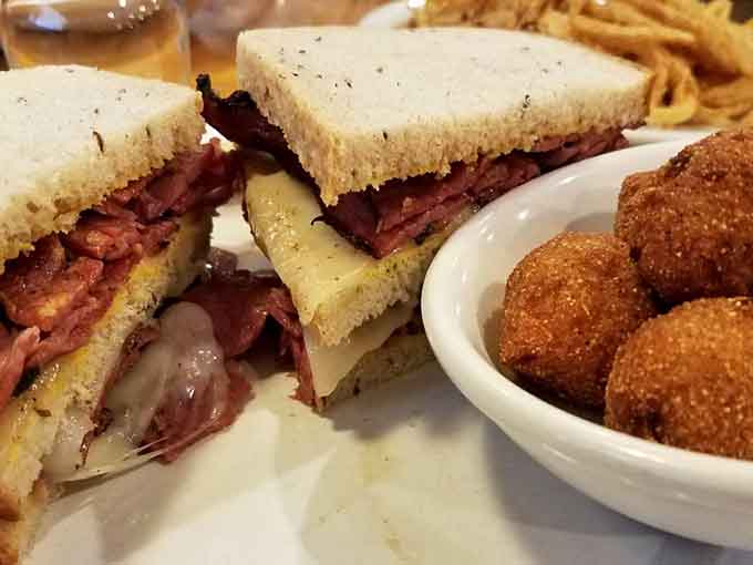 Behold the Reuben in all its glory, with corned beef, sauerkraut, and melted Swiss creating pure sandwich magic.