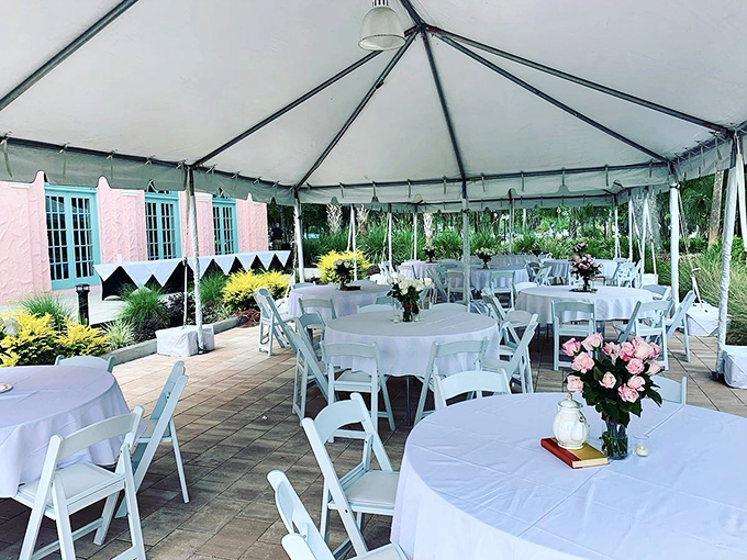 Outdoor Event Area: Under crisp white tents, celebrations unfold with understated elegance – each table adorned with fresh flowers that seem to have bloomed specifically for your arrival.