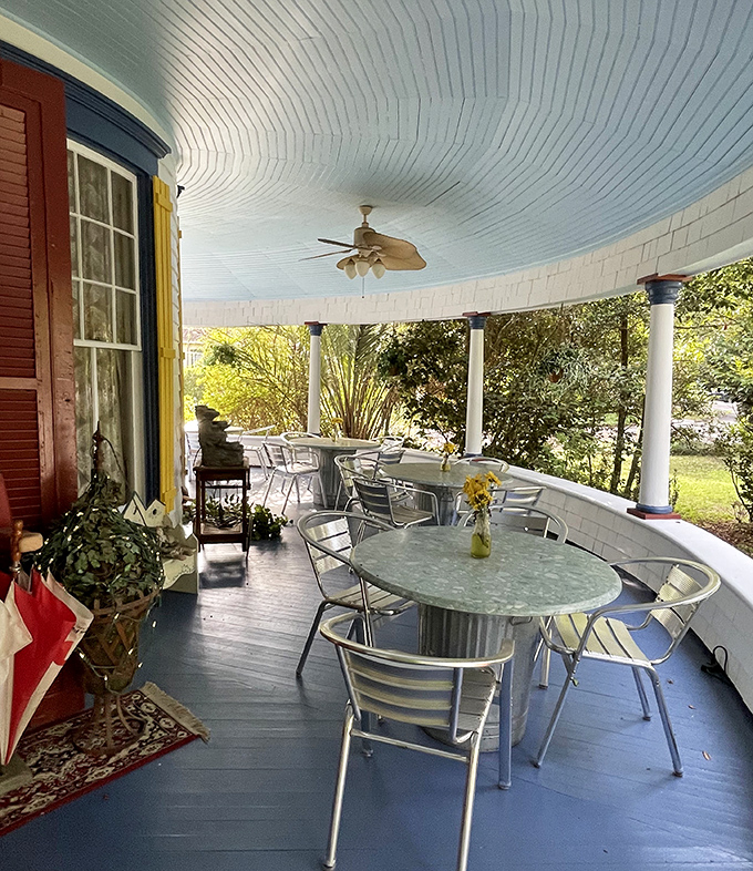 The curved veranda offers peaceful seating under a traditional blue ceiling&mdash;painted this color not just for beauty, but according to Southern tradition, to ward off spirits.