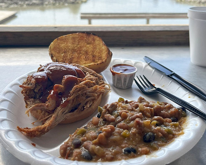 Barbecue with a view&mdash;this pulled pork sandwich isn't just lunch, it's waterfront therapy with a side of smoky perfection.