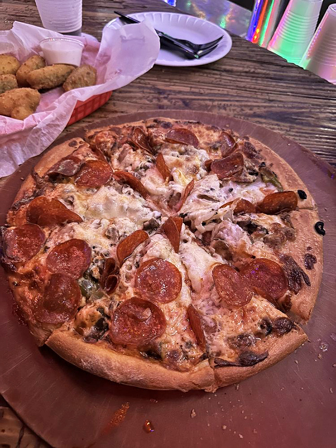 This pepperoni pizza isn't trying to be artisanal or gourmet – it's just trying to be the perfect companion to cold beer and warm conversation.