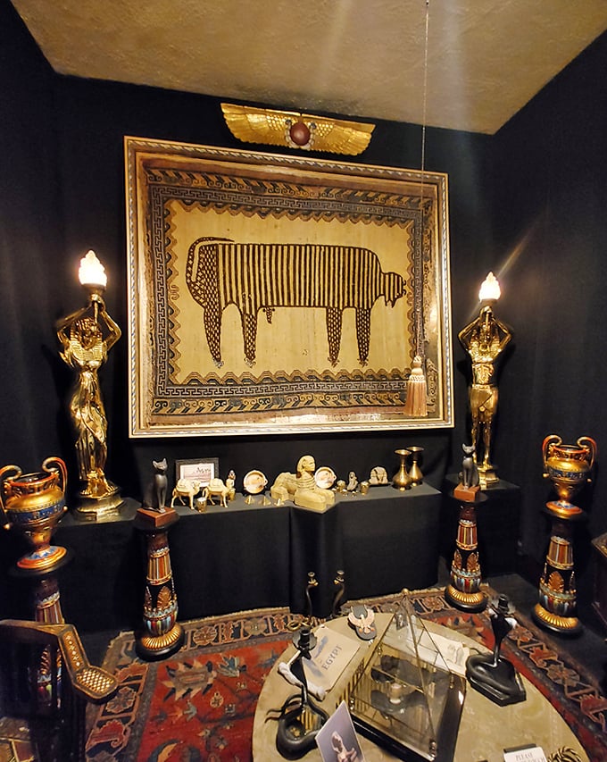 The legendary Sacred Cat Rug display, where 2,400-year-old Egyptian feline fur rests behind protective barriers, still commanding reverence.