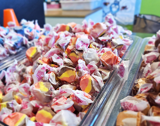 Salt water taffy in rainbow hues proves that sometimes the best things in life come wrapped in wax paper and childhood memories.