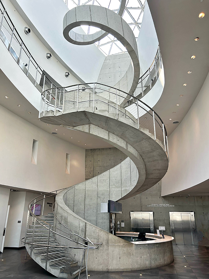 This gravity-defying spiral staircase isn't just functional&mdash;it's a concrete DNA strand connecting visitors to Dal&iacute;'s artistic evolution.