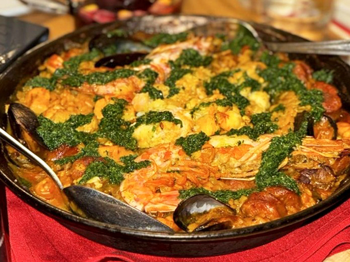 This isn't just paella &ndash; it's a seafood fiesta in a pan, where saffron-kissed rice meets the ocean's bounty in spectacular harmony.