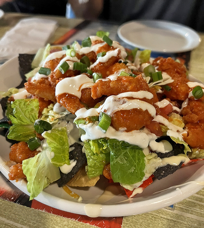 These aren't your average nachos &ndash; crispy wonton chips loaded with spicy shrimp, fresh lettuce, and a drizzle that ties everything together.