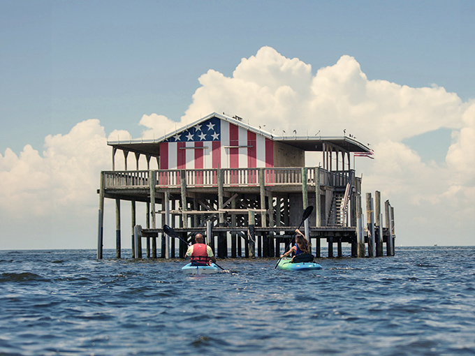 Stars and stripes wave welcome from this weathered outpost, where kayakers discover Florida's unique architectural history.