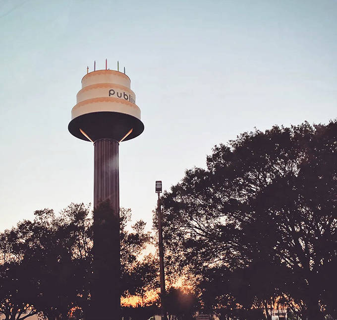 As the sun sets, the cake tower takes on a golden glow, transforming from quirky roadside attraction to something almost ethereal.