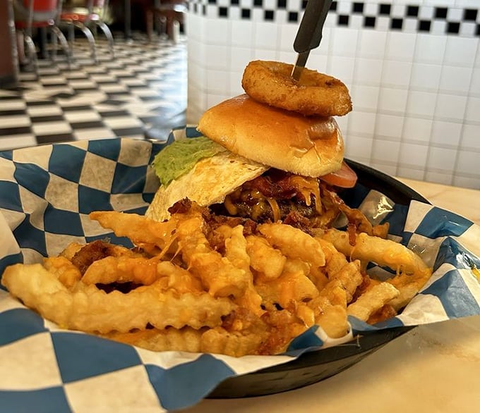This Texas Burger doesn't just satisfy hunger &ndash; it conquers it. The onion ring crown adds both crunch and architectural magnificence.