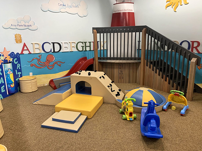 Tiny tots explore a world built just for them, complete with lighthouse slide and sensory-rich play elements.