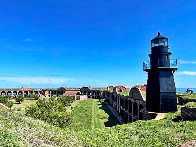 The historic Tortugas Harbor Light stands sentinel on the fort's corner, a reminder of the days when its beam guided mariners through treacherous waters.