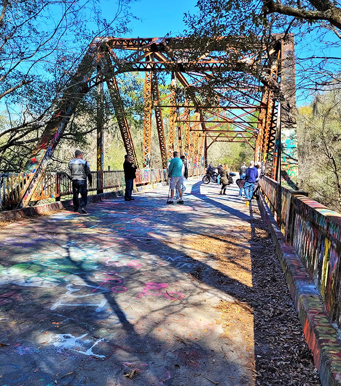 Visitors explore the colorful expanse, each finding their own meaning in this unexpected outdoor gallery that changes with every new artist's contribution.