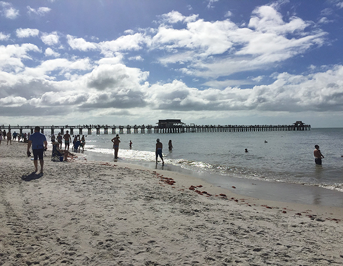 Beachgoers enjoy the rare luxury of personal space on this pristine shore, where crowds are refreshingly absent.