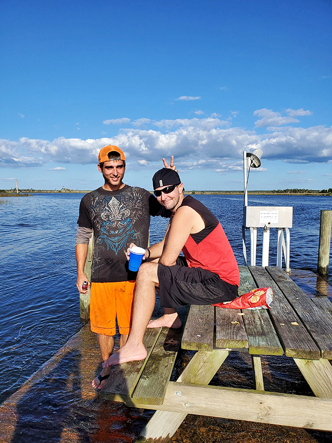 Visitors enjoying a moment of riverside camaraderie &ndash; because shared adventures create bonds stronger than any social media connection.