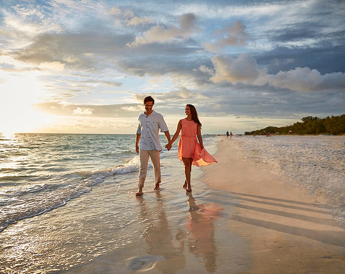 Sunset strolls along Anna Maria's shoreline &ndash; where everyday couples transform into silhouettes worthy of a romance novel cover.