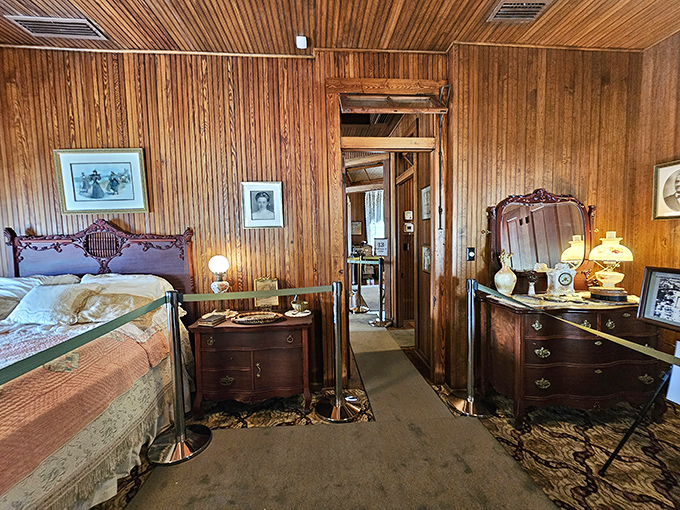 Step into this bedroom and you'll wonder how Floridians survived summer nights before AC, with only wooden walls and ceiling fans for comfort.