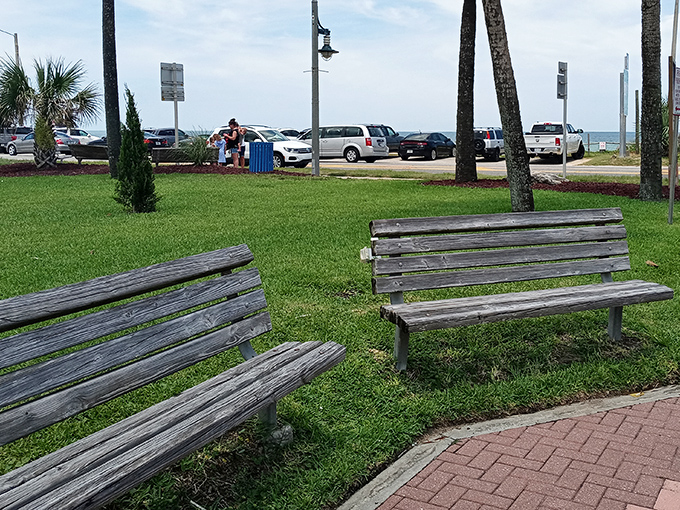 Weather-worn wooden benches invite visitors to pause, breathe, and remember what vacation is actually supposed to feel like.