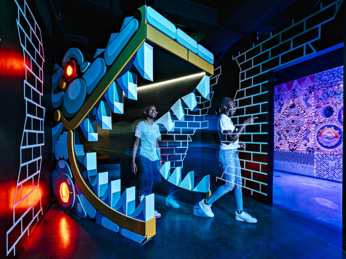 Jaws drop at the cyborg gator mouth entrance&mdash;Florida's favorite reptile reimagined as a portal between worlds.