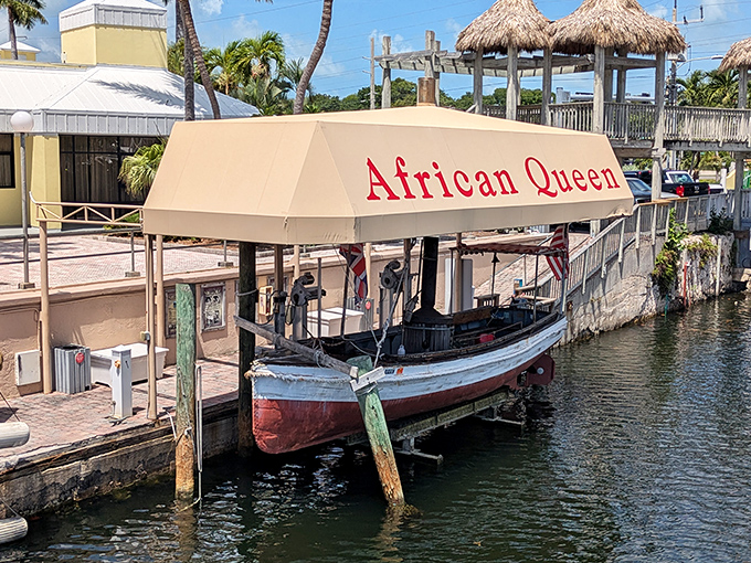Docked but never dormant, the African Queen waits patiently for her next adventure, British and American flags fluttering in the Florida breeze.