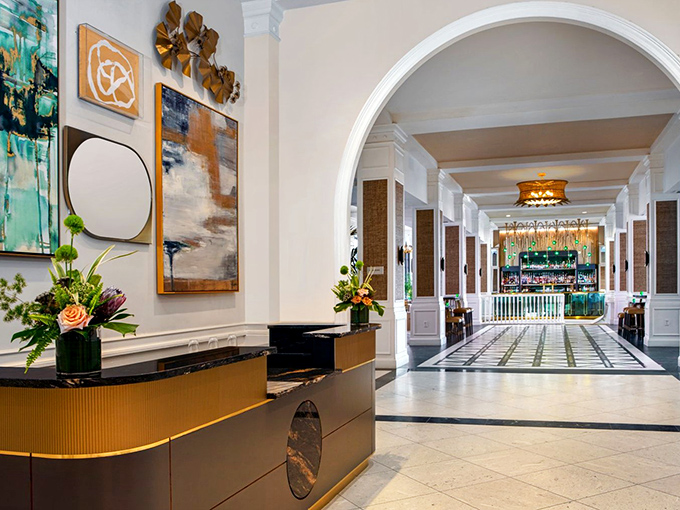 The elegant lobby welcomes guests with a perfect blend of historic charm and modern sophistication &ndash; your first taste of The Pink Palace experience.