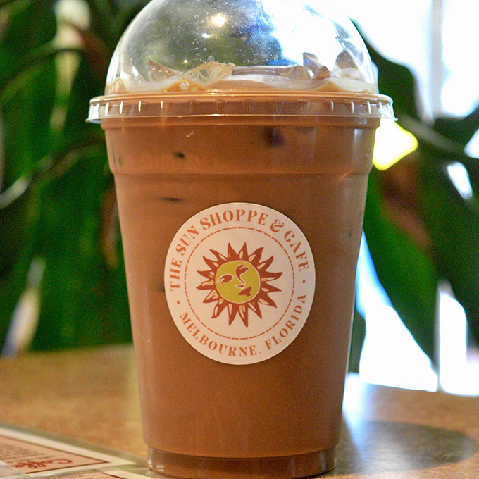 This isn't just iced coffee; it's liquid salvation in Melbourne's heat, complete with that iconic smiling sun.