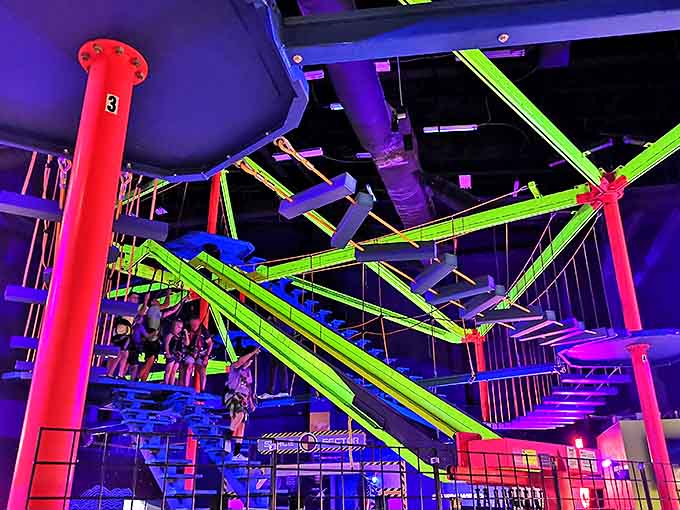 The Indoor Ropes Course challenges gravity-respecting humans to navigate a neon jungle gym suspended high above the safety of solid ground.