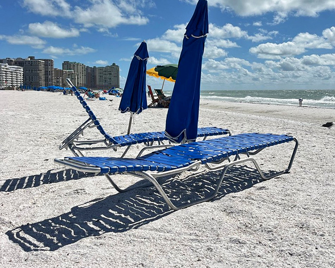 Beach day essentials: Blue loungers await sun-worshippers under matching umbrellas &ndash; Florida's version of rolling out the welcome mat.