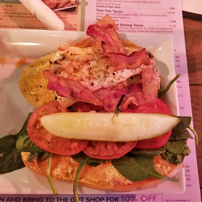 The star attraction: a perfectly grilled Mahi Mahi BLT where fresh fish meets crispy bacon in a sandwich that demands two hands.