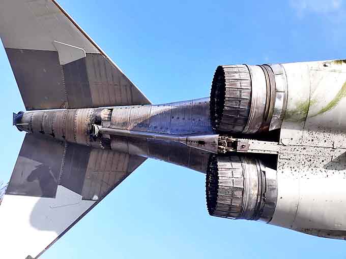 Twin engines that once roared at Mach 2 now whisper stories of high-altitude missions to curious visitors below.