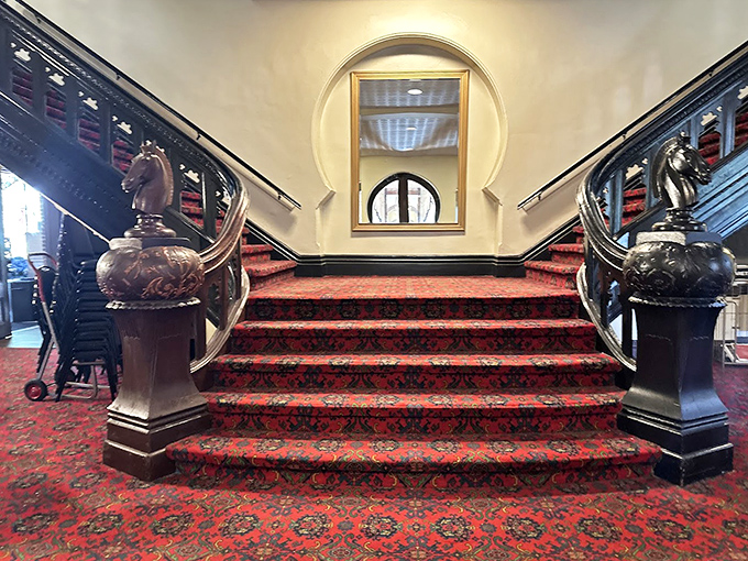 The grand staircase practically begs for a dramatic entrance &ndash; its ornate newel posts and rich carpeting have witnessed over a century of footsteps.