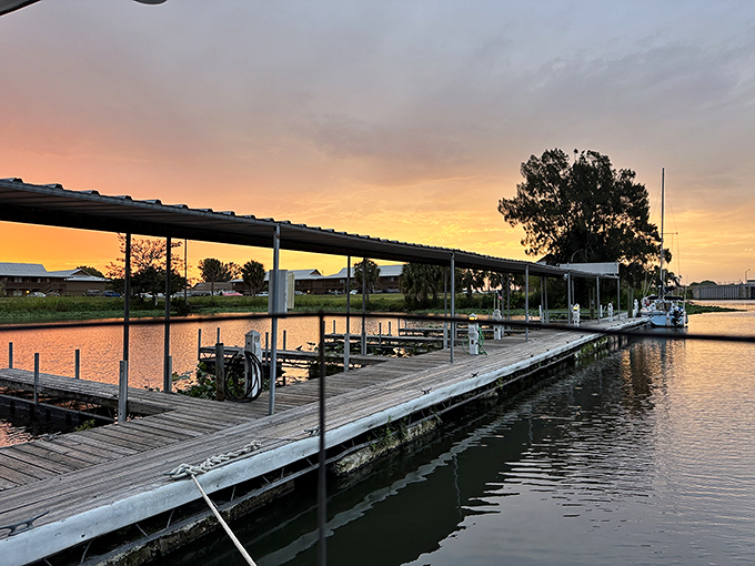 Mother Nature puts on her nightly watercolor show, painting the marina in golden hues as the water settles into a quiet, peaceful glow.